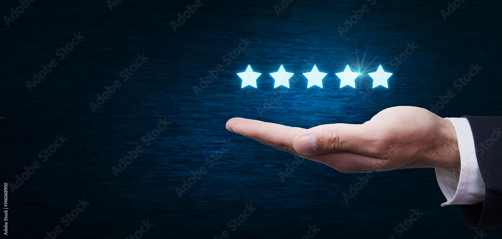 Hand holding five stars. Stock Photo | Adobe Stock