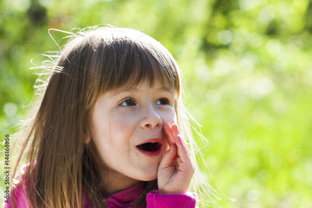 Close-up portrait of a little pretty girl with shouting face expression ...