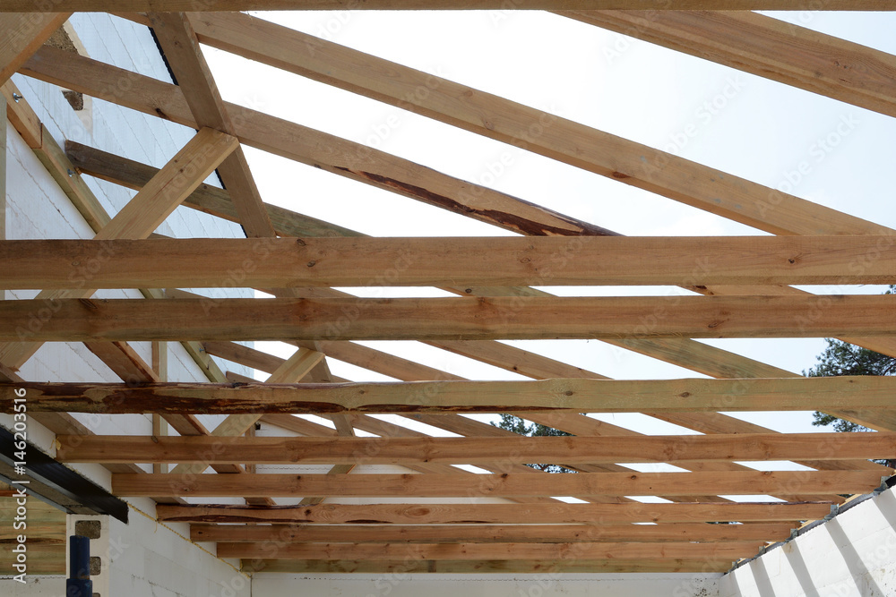 The wooden structure of the building. Wooden frame building. Wooden ...