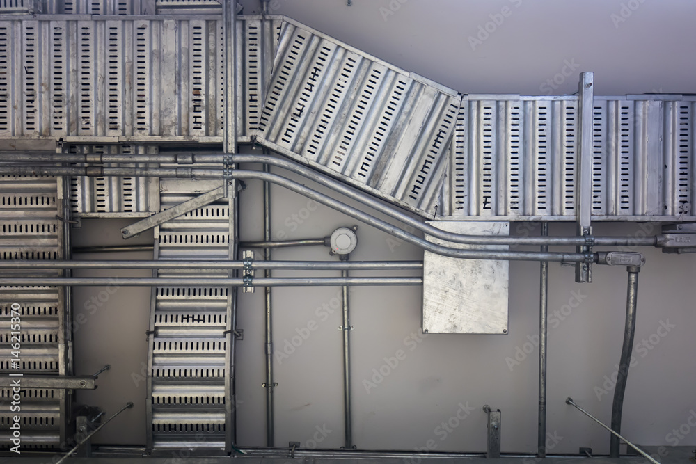 The cable tray and piping construction Stock Photo | Adobe Stock