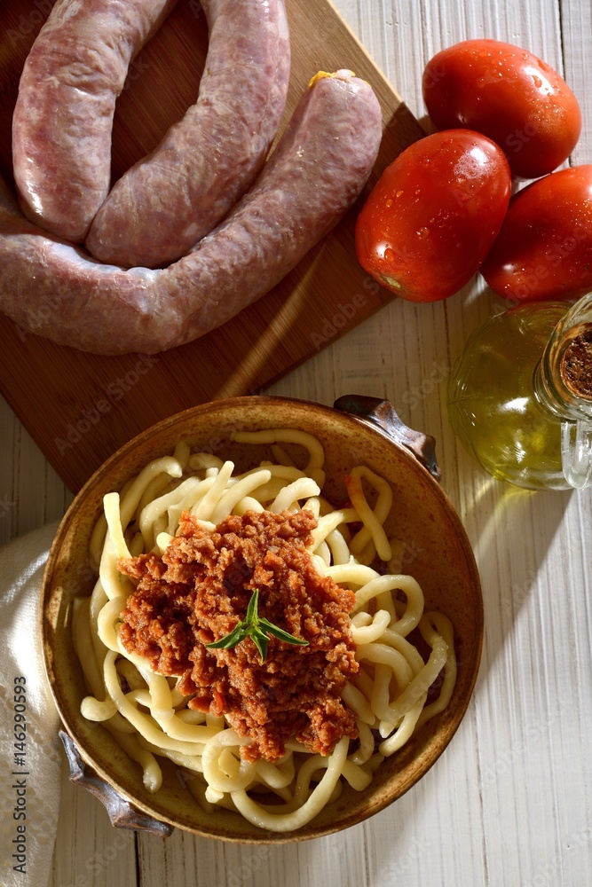 Pici with garlic and sausage Stock Photo | Adobe Stock