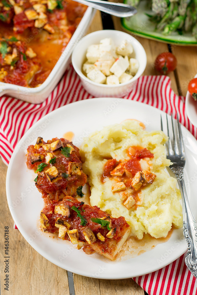 Fish cod baked in tomato sauce with feta cheese foto de Stock | Adobe Stock