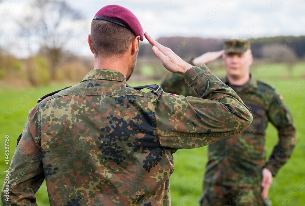 two german soldiers salute each other Stock-Foto | Adobe Stock