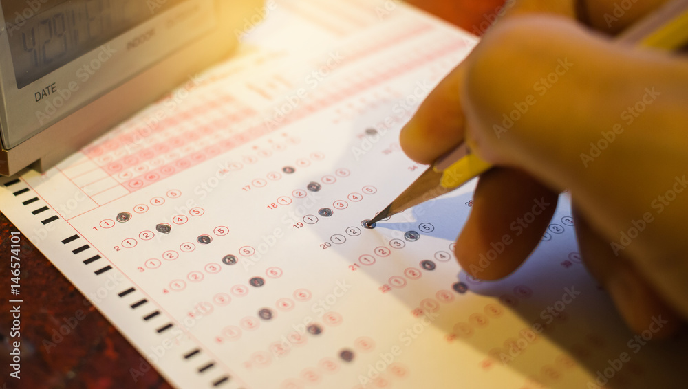 alarm digital clock on optical form standardized test with bubbled and ...