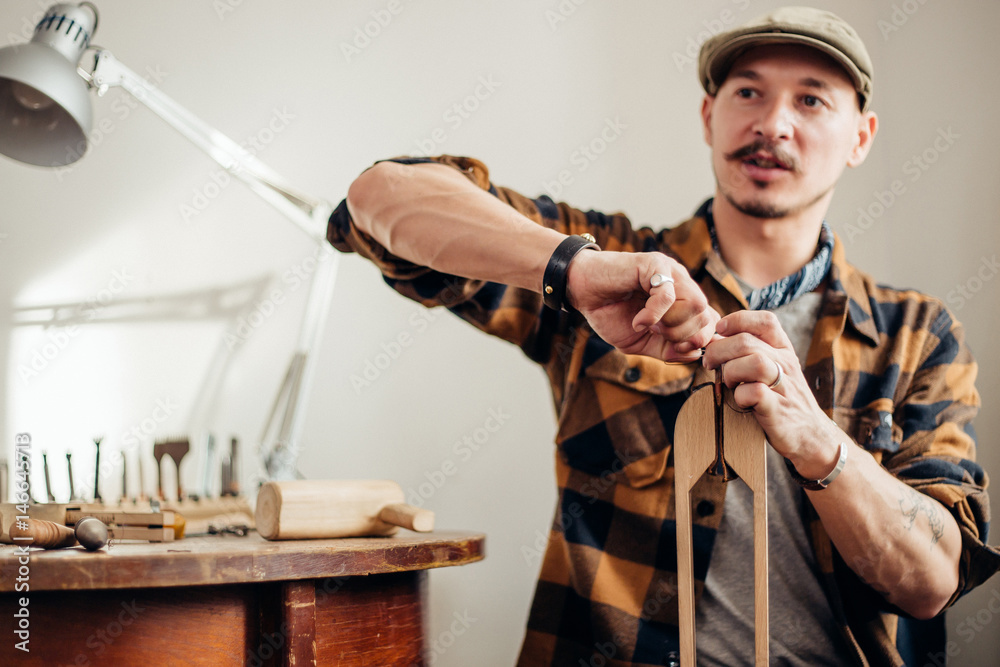 caucasian leather craft mustache man wearing cup working as artisan in ...