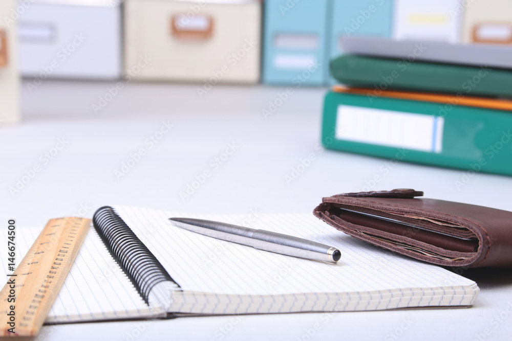 Folder file, note and wallet on the desk. blurred background. Stock ...