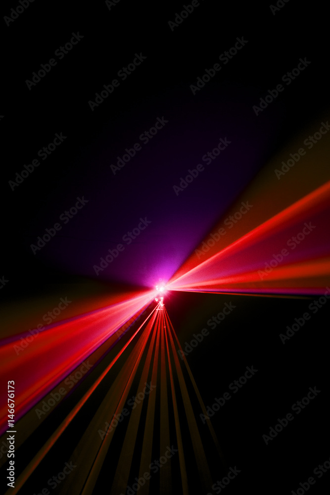 Laser beam red on a black background Stock Photo | Adobe Stock