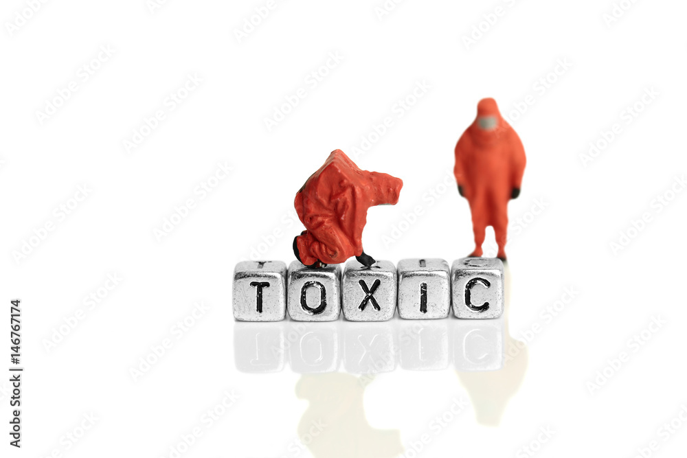 Miniature scale model team in chemical suits with the word toxic on ...