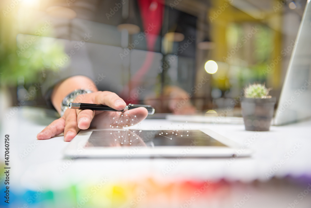 Businessman making presentation on office table with smart phone and ...