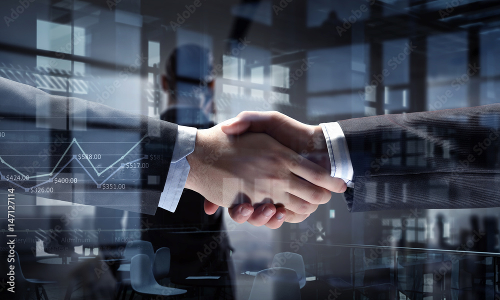 Partners shaking hands as symbol of deal Stock Photo | Adobe Stock