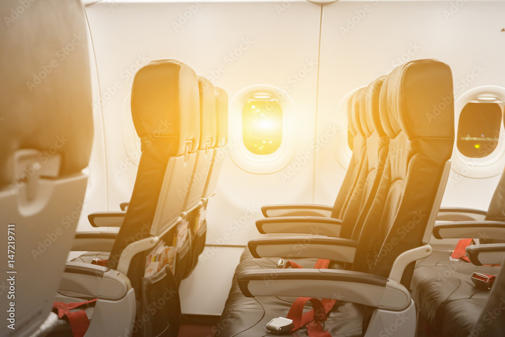 Empty seats in economy class passenger section of airplane near window ...