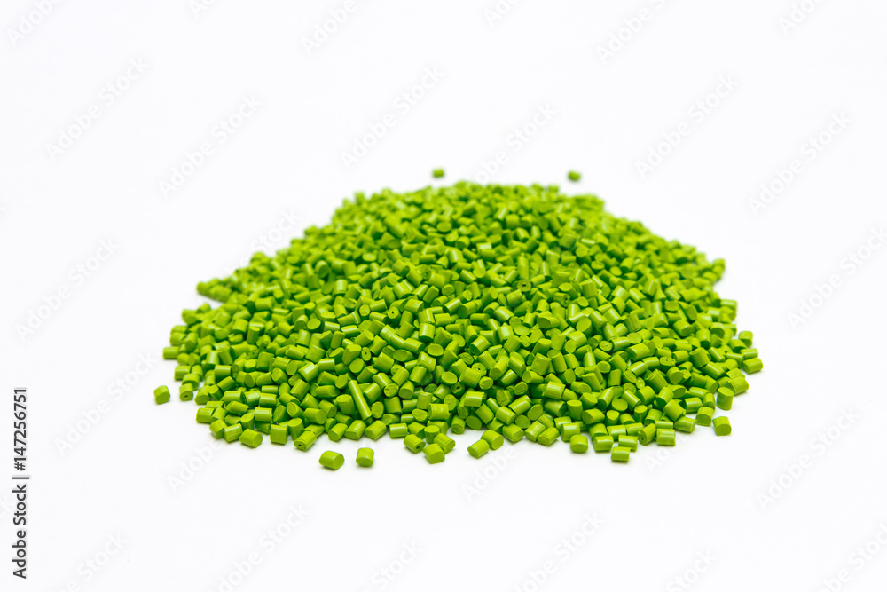 Green plastic pellets on a white background. Polymeric dye for plastics ...