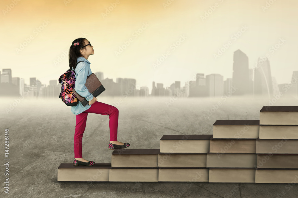 Cute child with bag and book Stock Photo | Adobe Stock