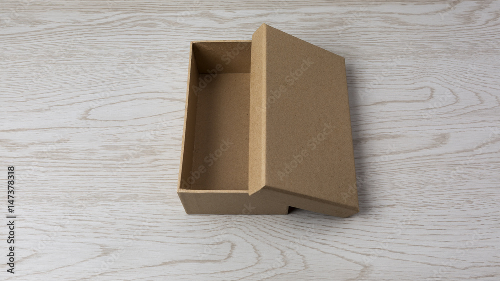 Uncovered Cardboard plain Box on white wooden Background Stock Photo ...