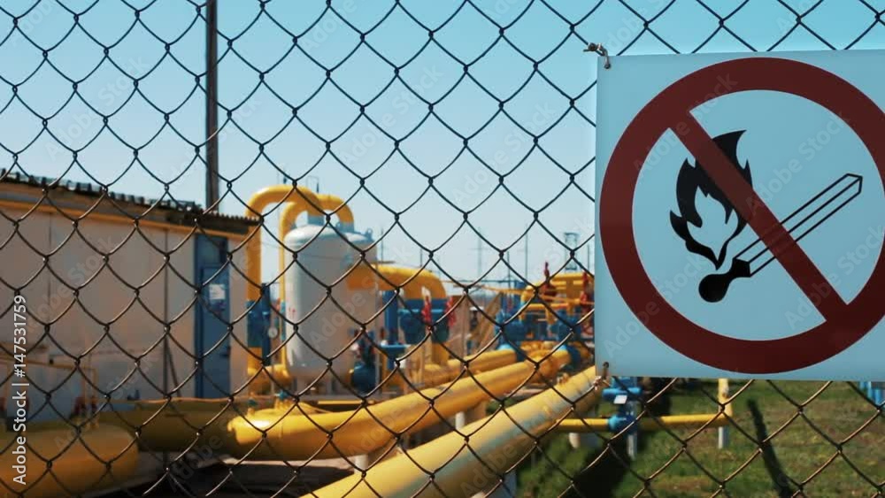 Oil and gas industry. Natural gas processing station. Warning sign of ...