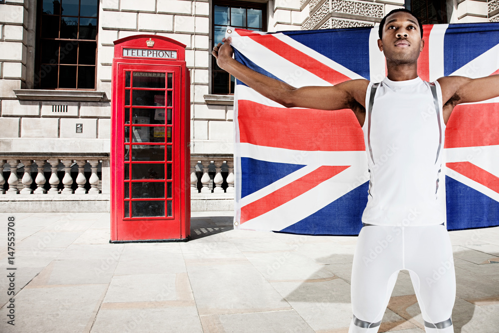 Olympic competitor with Union Jack and red telephone box in background ...