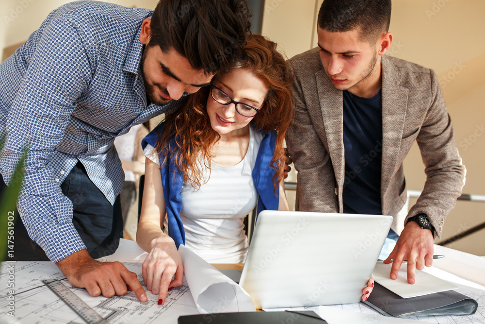 Group of office workers working on new project .Team work concept ...