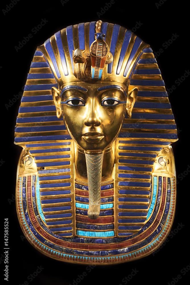 Replica of funerary mask of Tutankhamun. Isolated on black background ...