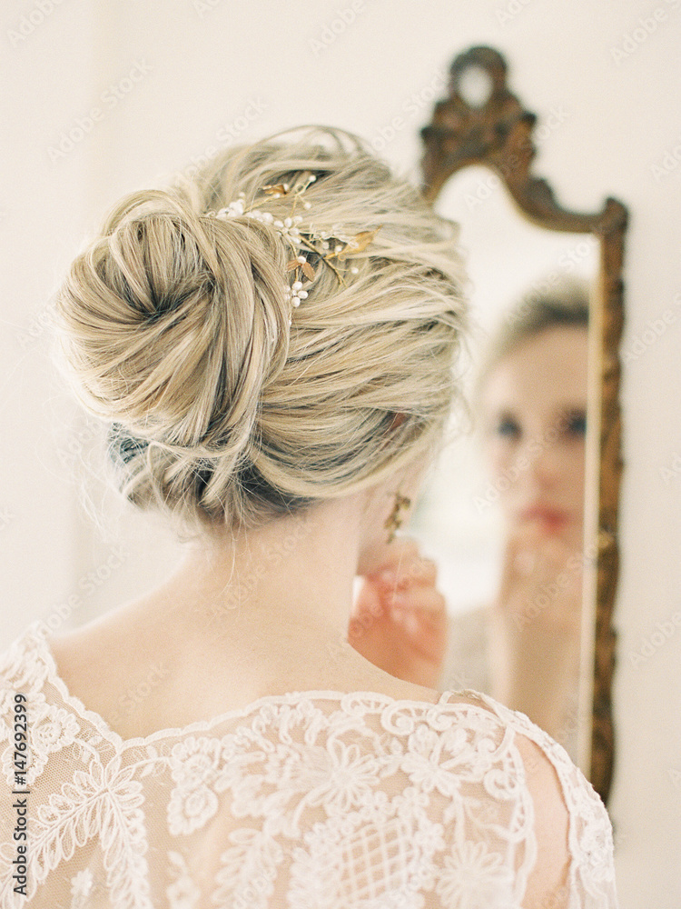 Bride looking into mirror Stock Photo | Adobe Stock