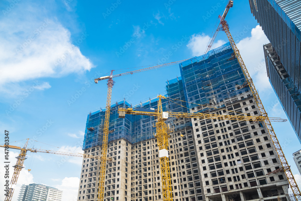 Construction site next to modern office, residential building. Working ...