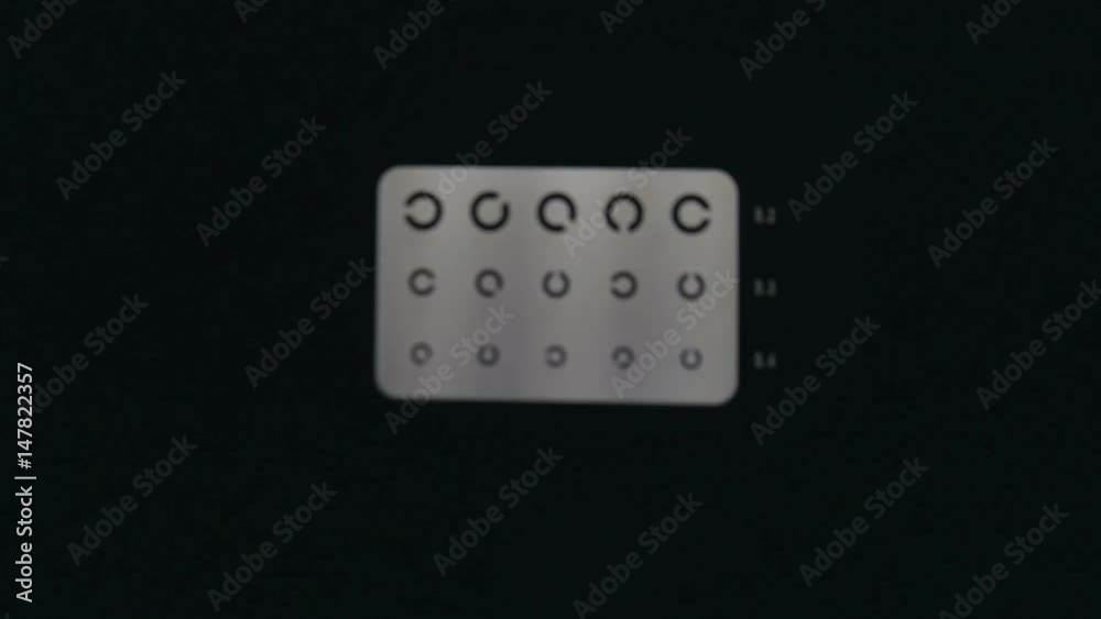 Magnifying Glass Scanning over Eye Test for Optician - Medical Concept ...