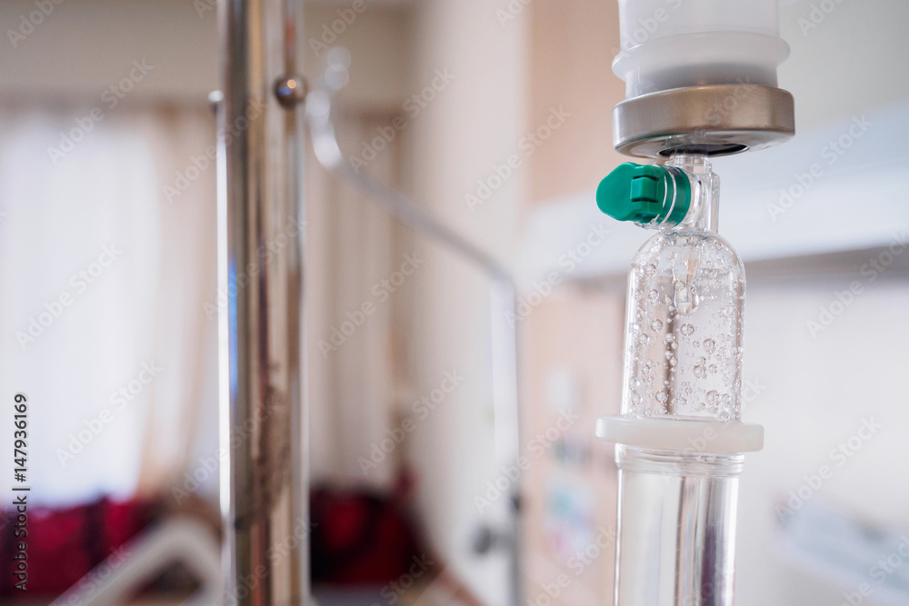 Medical drip with hospital blurred background Stock Photo | Adobe Stock