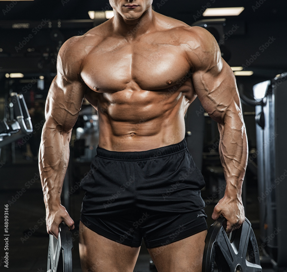 Brutal strong athletic men pumping up muscles workout bodybuilding ...