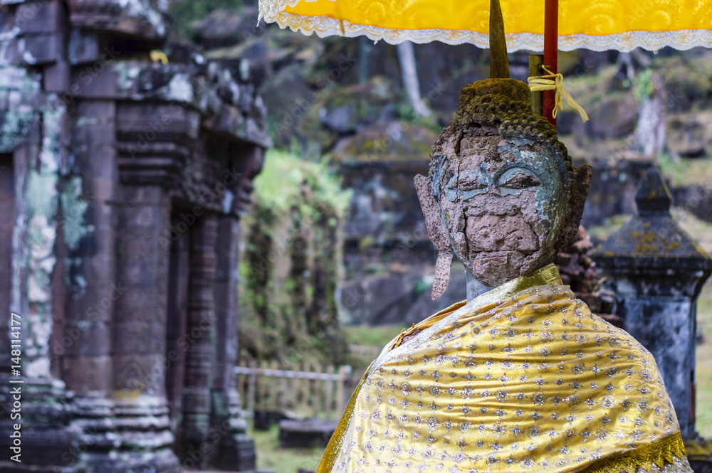 Creepy looking old ancient ruined carved in stone Buddha sculpture in ...