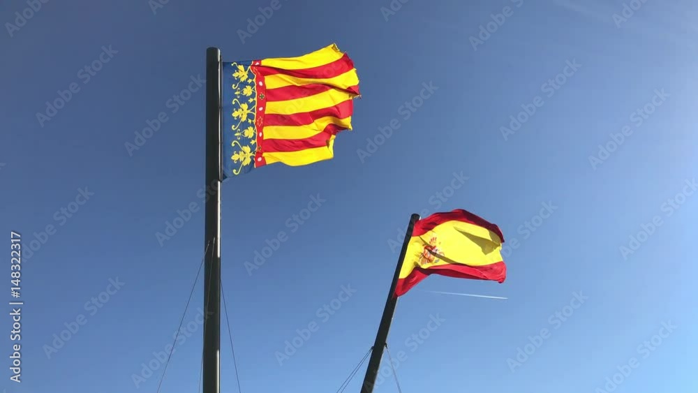 Flags of Spain and the autonomous community of Valencia waving in the ...