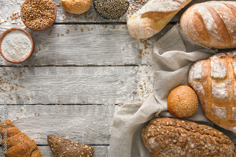 Bread bakery background. Brown and white wheat grain loaves composition ...