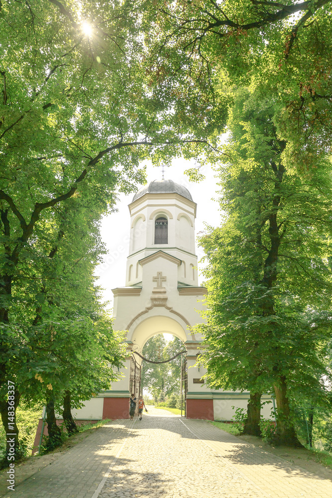 Alley to the gate in the tower of Ostrog castle. The attraction of the ...