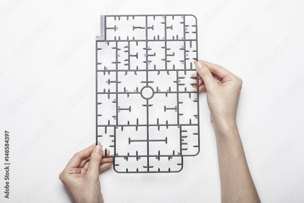 woman hand hold a plastic modeling parts isolated white, background ...