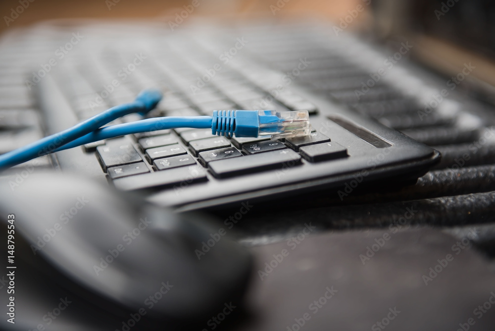 ethernet cable plug connector on computer laptop keyboard technology ...