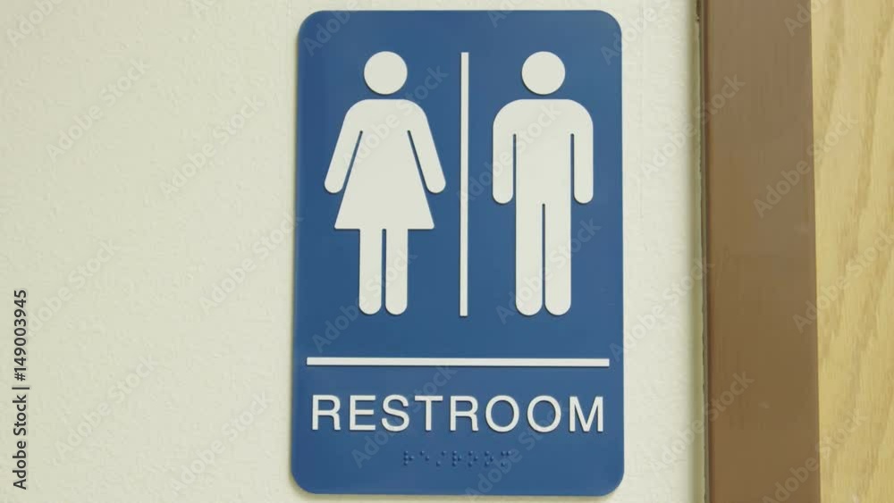 Bathroom restroom sign showing male and female symbols. Shot in 4K UHD ...