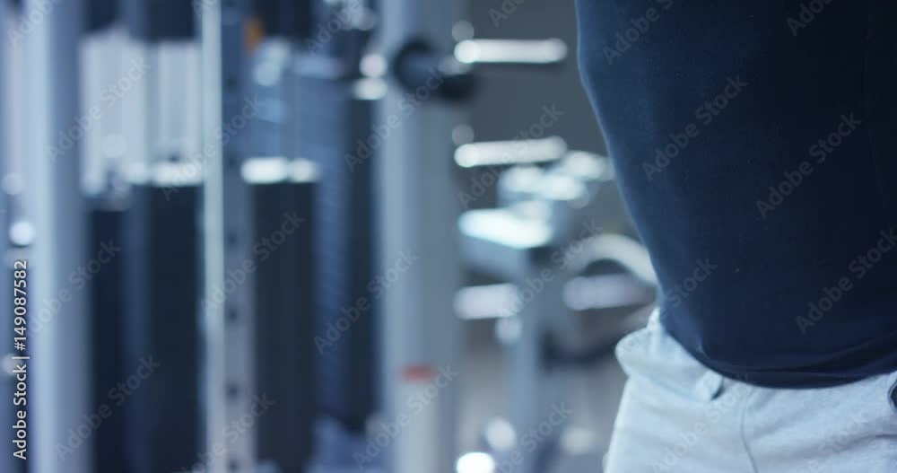 Guy bodybuilder in the gym, works with a barbell, bench press ...