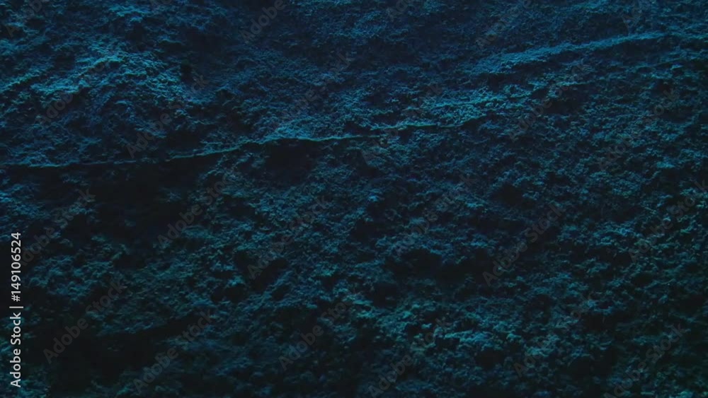 Stone texture underwater in blue light. Abstract video background ...