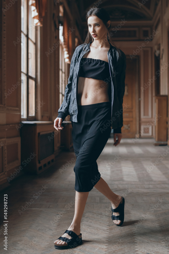 Beautiful Sexy Model In Black Top Windbreakert Skirt And Slippers