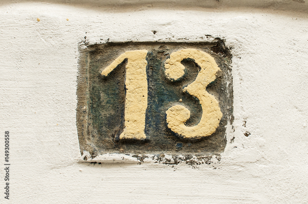 Old retro weathered cast iron plate with number 13 closeup Stock Photo ...