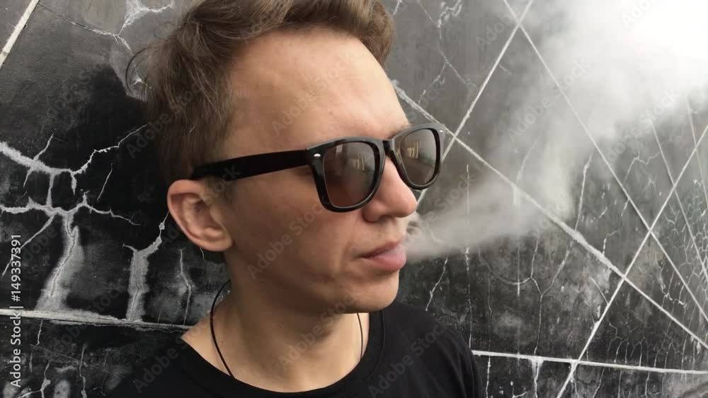 Young Vaper Man Exhaling Big White Clouds of Smoke with e-cigarette ...
