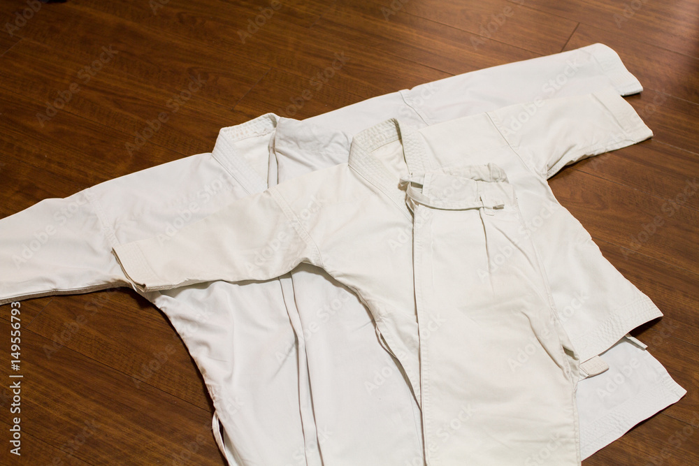 A pair of Gi ( martial arts uniform) for adult and children to practice ...