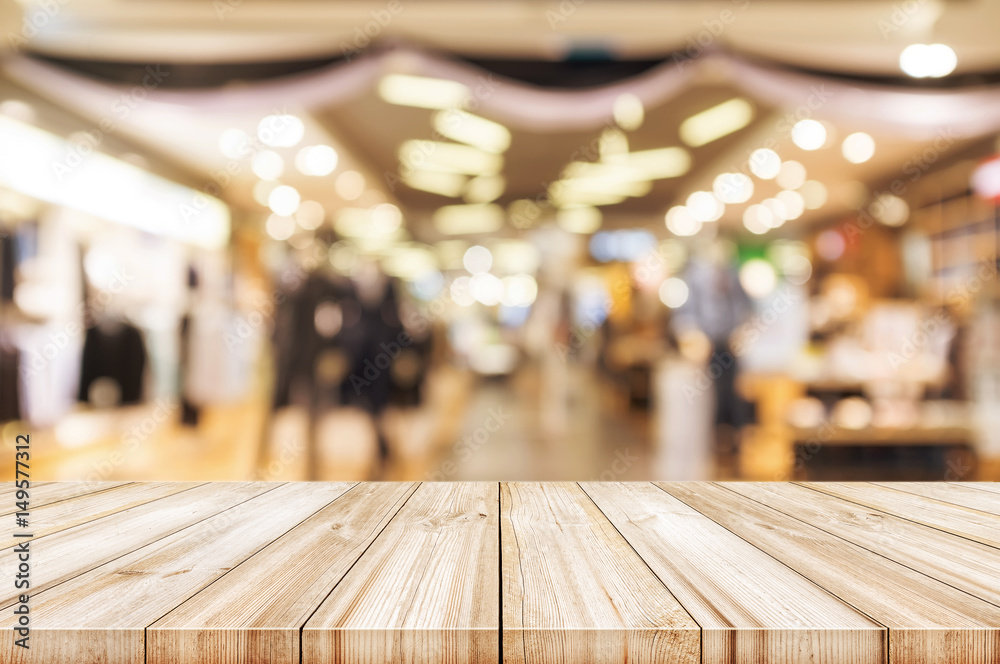 Empty wooden table top with blurred modern shopping mall background ...