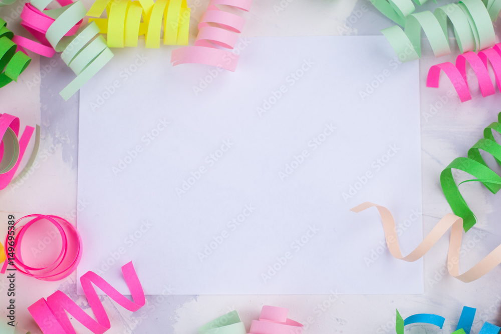 Festive party border or frame of colorful spiral streamers arranged on ...