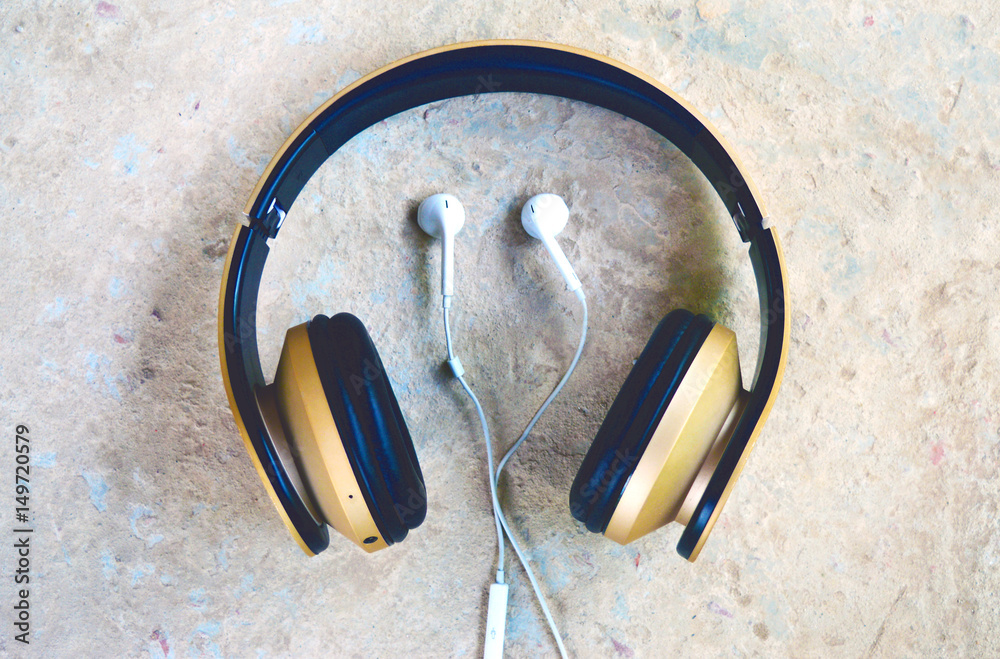 Headphone on Textual Background Stock Photo | Adobe Stock