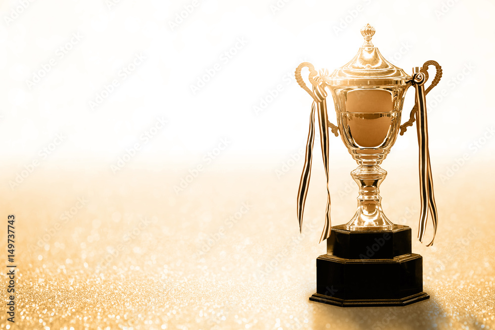 Gold Trophy competition on the abstract glitter background with copy ...