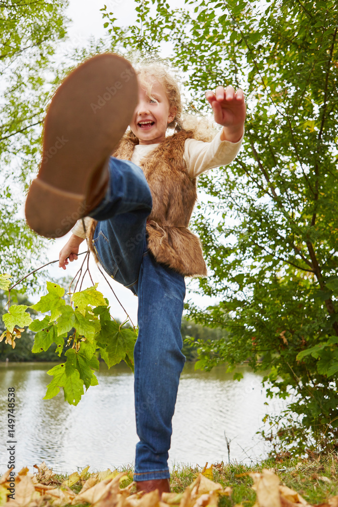 Child romp in autumn in the nature Stock Photo | Adobe Stock
