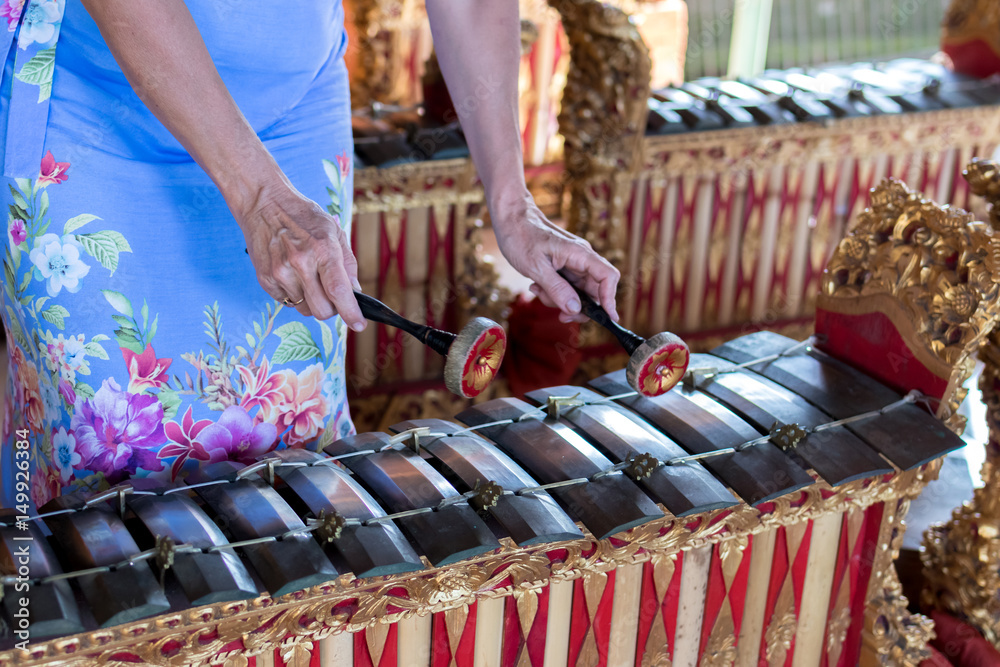 Woman hands and Traditional Balinese music instrument gamelan. Bali ...