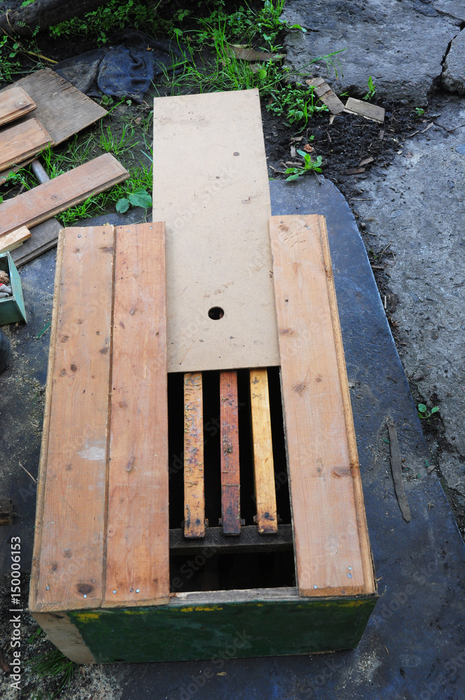 Beekeeper building wooden trap for wild bees or for swarming bees ...