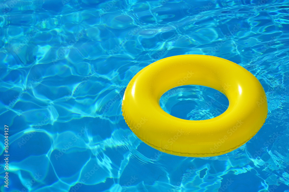 Colorful inflatable tube floating in swimming pool Stock Photo | Adobe ...