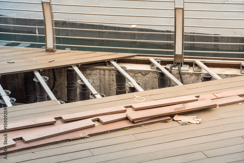 Remodel of timber boardwalk, wooden walkway on shore of Singapore sea ...