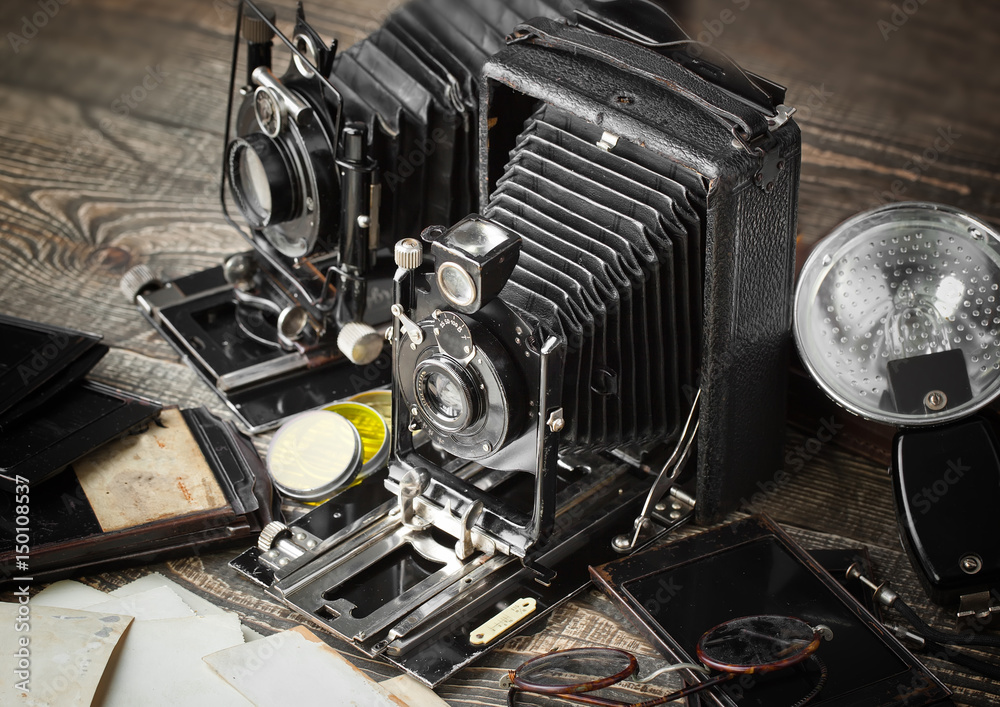Old camera on an old background on a close-up table Stock Photo | Adobe ...